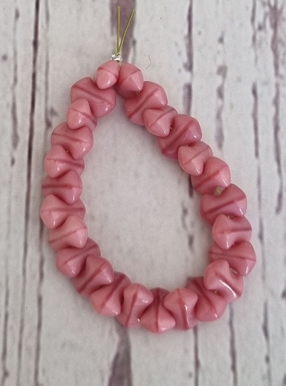 Rosa perler med midthull - Epla